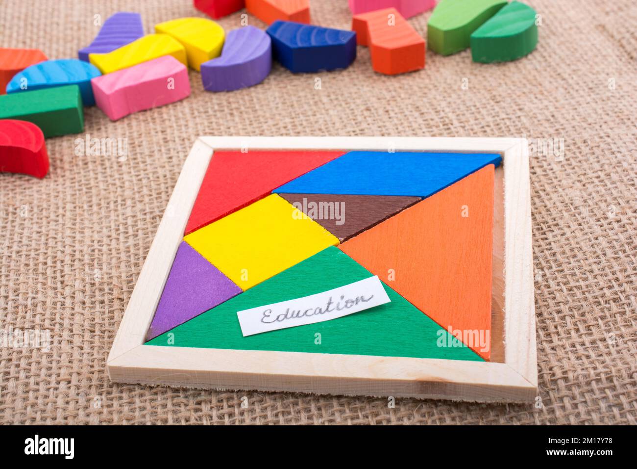 Colorful pieces of a square tangram puzzle Stock Photo - Alamy
