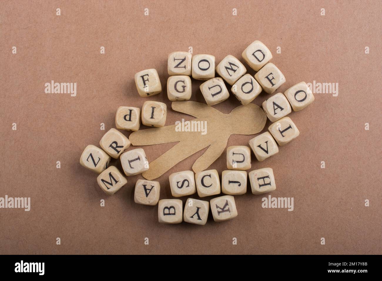 Paper man and letter cubes of made of wood Stock Photo - Alamy