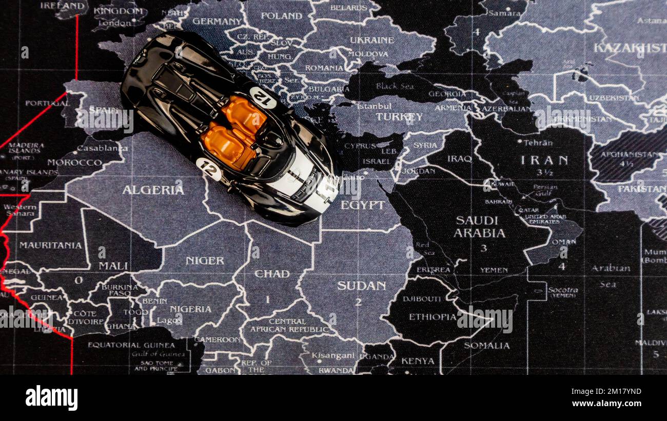 a black toy car over the map Stock Photo - Alamy