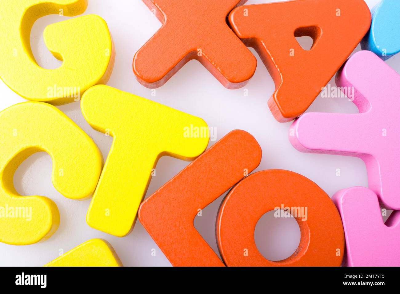 Colorful alphabet letter blocks scattered randomly on white background ...