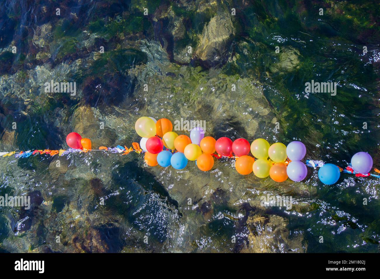 Balloons in shooting range as targets on water Stock Photo - Alamy