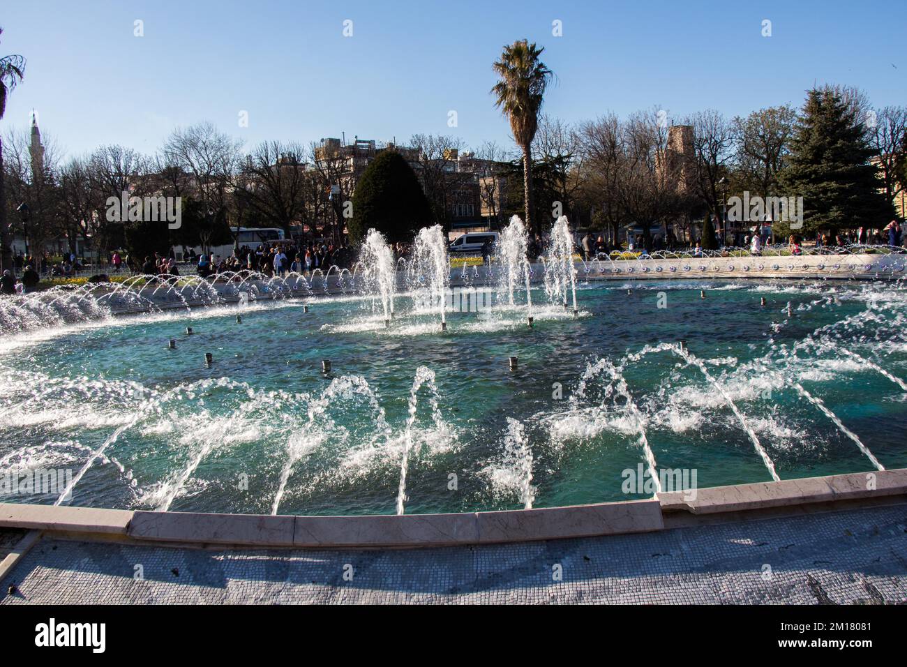 The fountains gushing sparkling water in a pool in a park Stock Photo ...