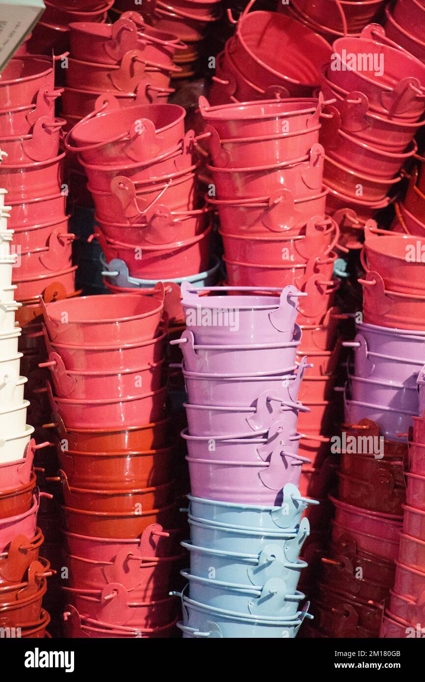 Little set of buckets of various colors in a market place Stock Photo ...