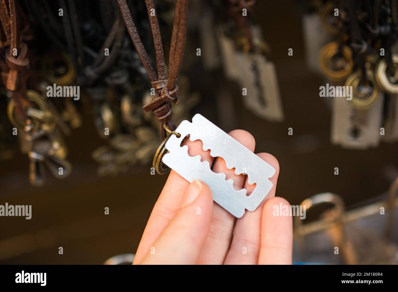 A steel razor blade necklace on sale in the view Stock Photo - Alamy