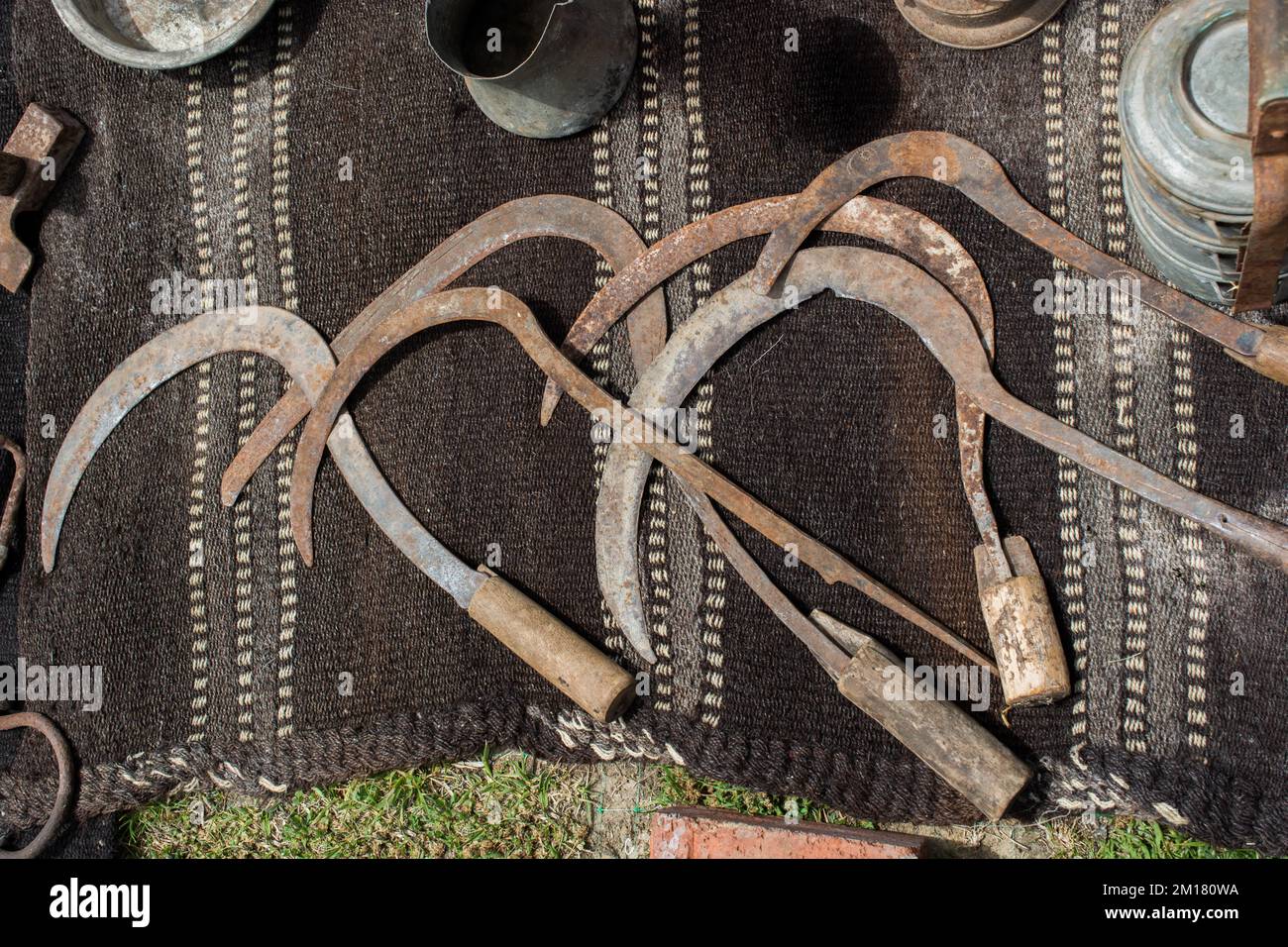 Group of rusty antique sickles in the view Stock Photo - Alamy