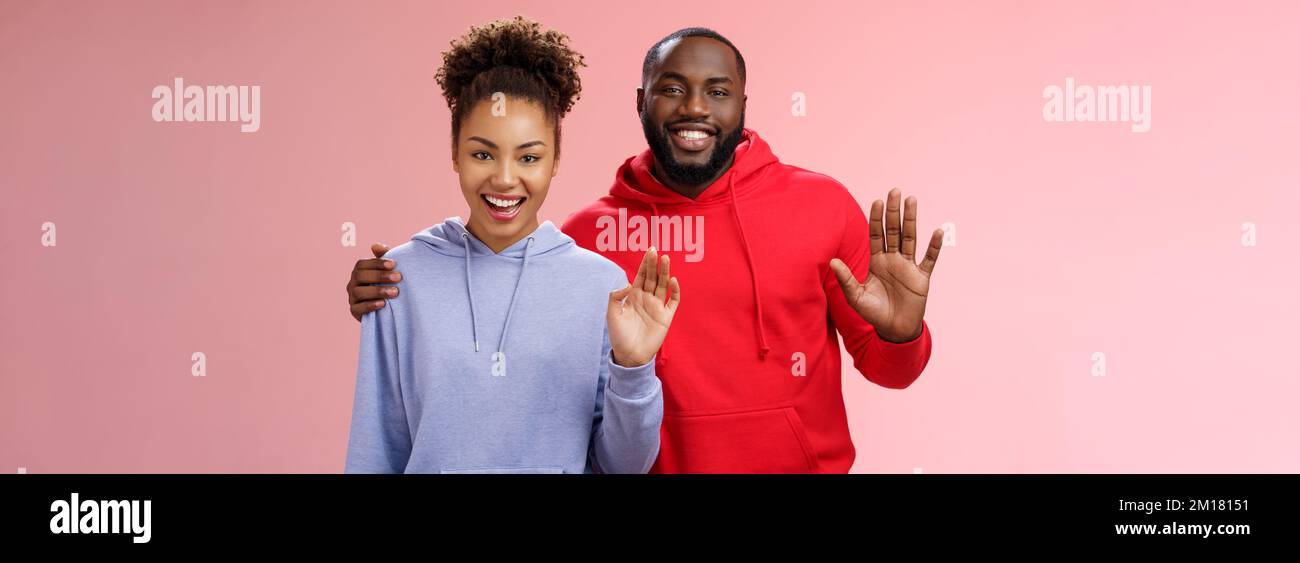 Happy african-american couple man woman hugging friendly guy embracing ...