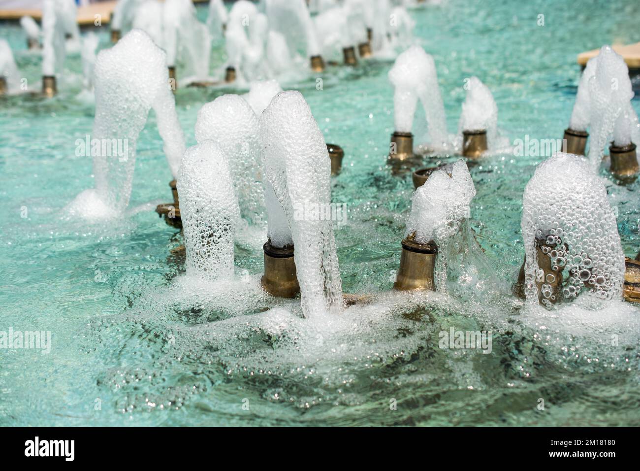 The fountains gushing sparkling water in a pool in a park Stock Photo ...