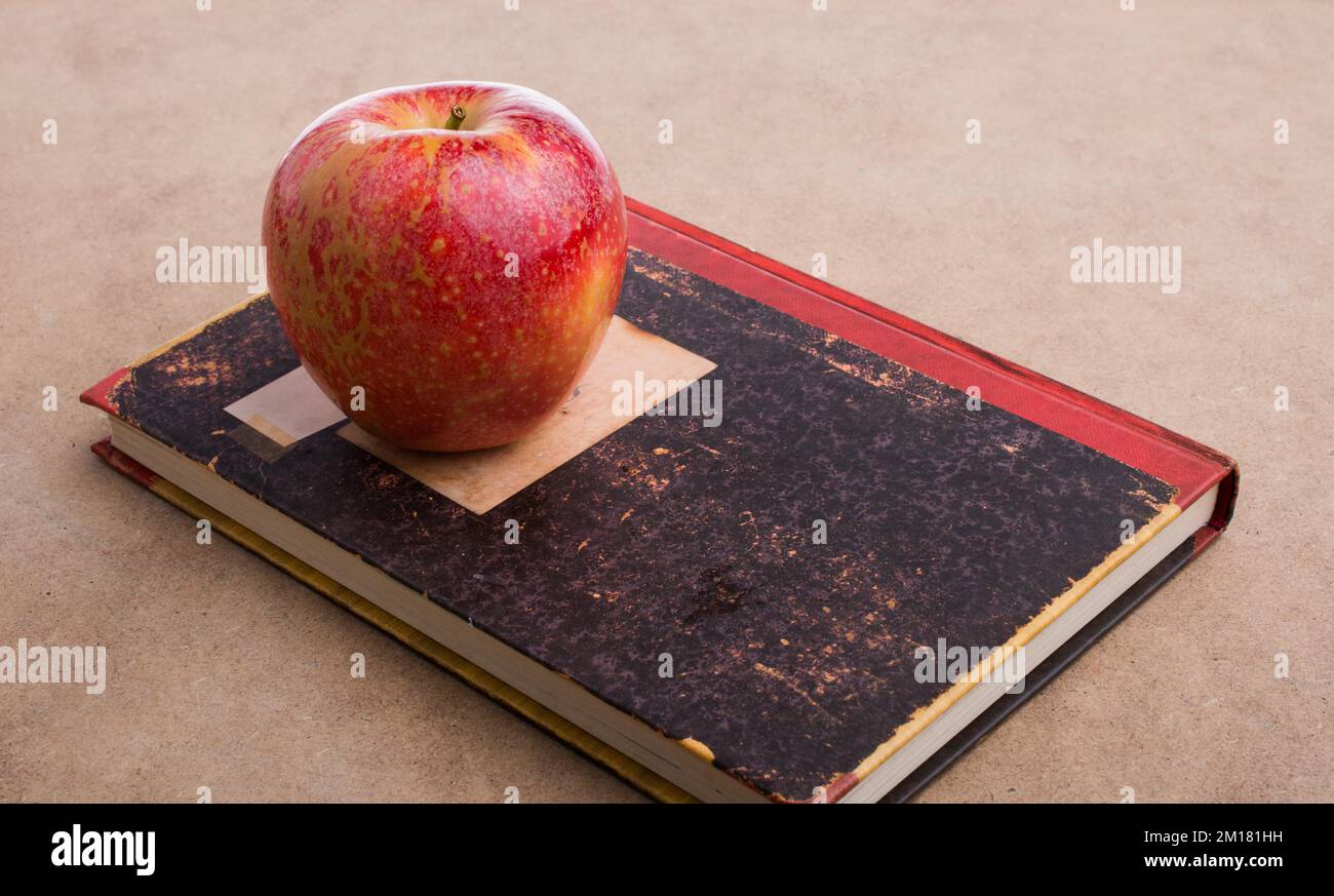 Back to school lettering and an apple on a book Stock Photo - Alamy