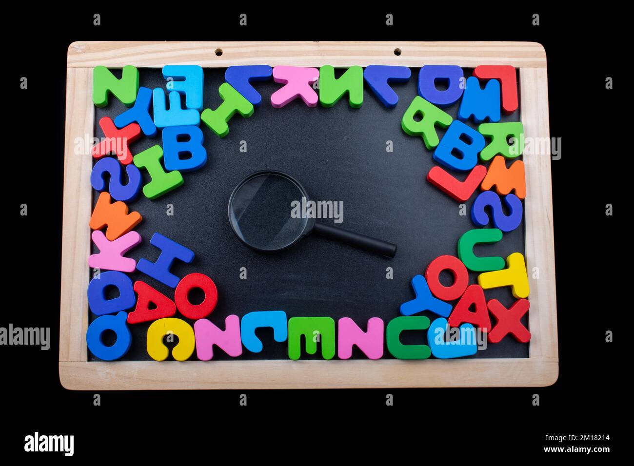 Magnifying glass and Colorful Letters of Alphabet Stock Photo - Alamy