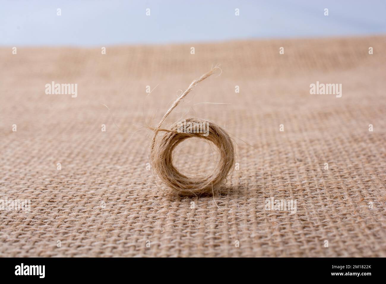 Roll of brown color linen string paper background Stock Photo - Alamy