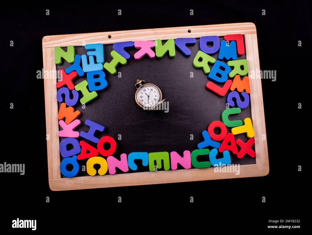 Pocket watch and colorful Letters of Alphabet made of wood Stock Photo ...