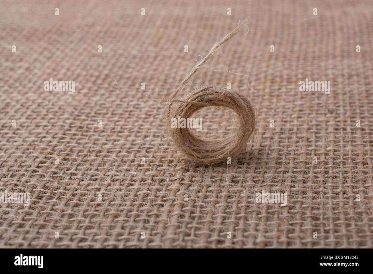 Roll of brown color linen string paper background Stock Photo - Alamy