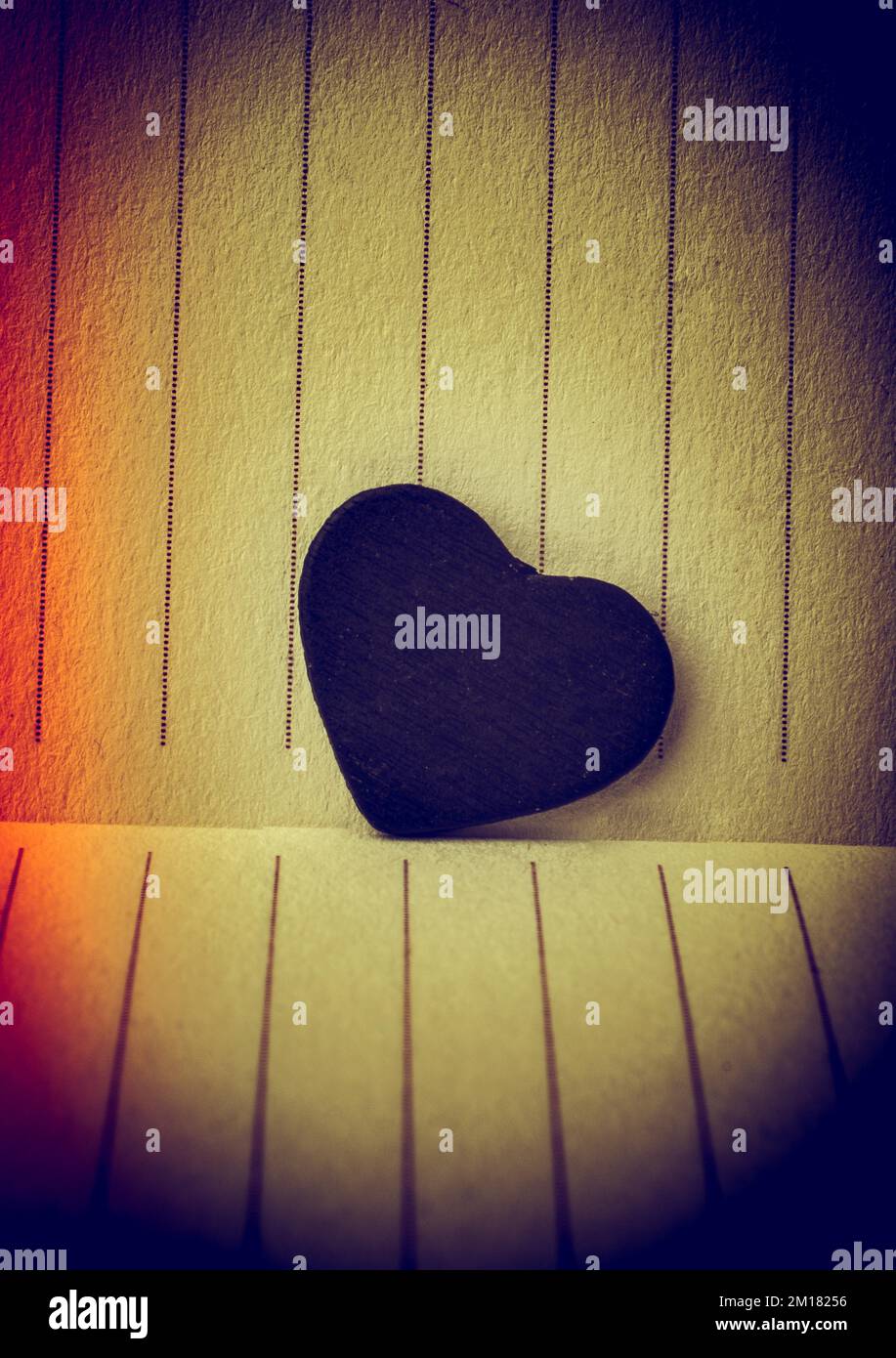 Heart shaped objects on the lined paper Stock Photo - Alamy