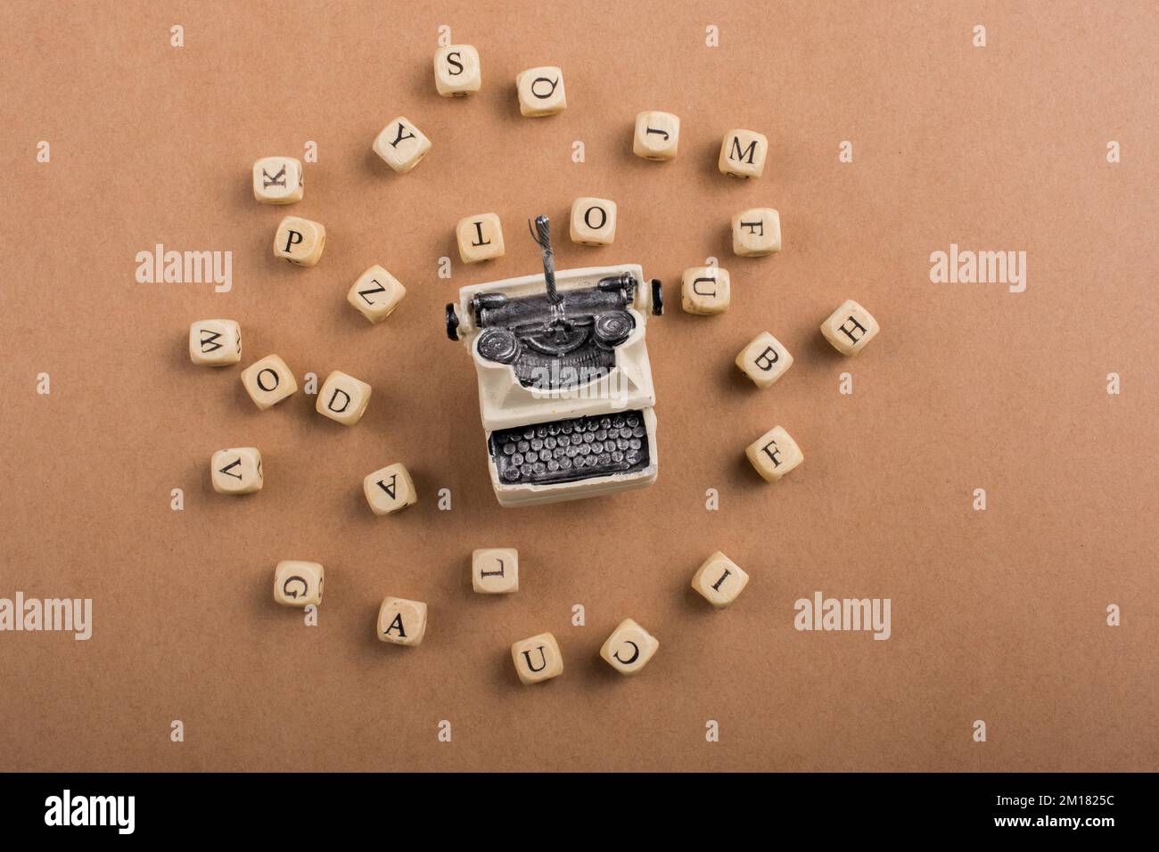 Letter cubes of made of wood around model typewritter Stock Photo - Alamy