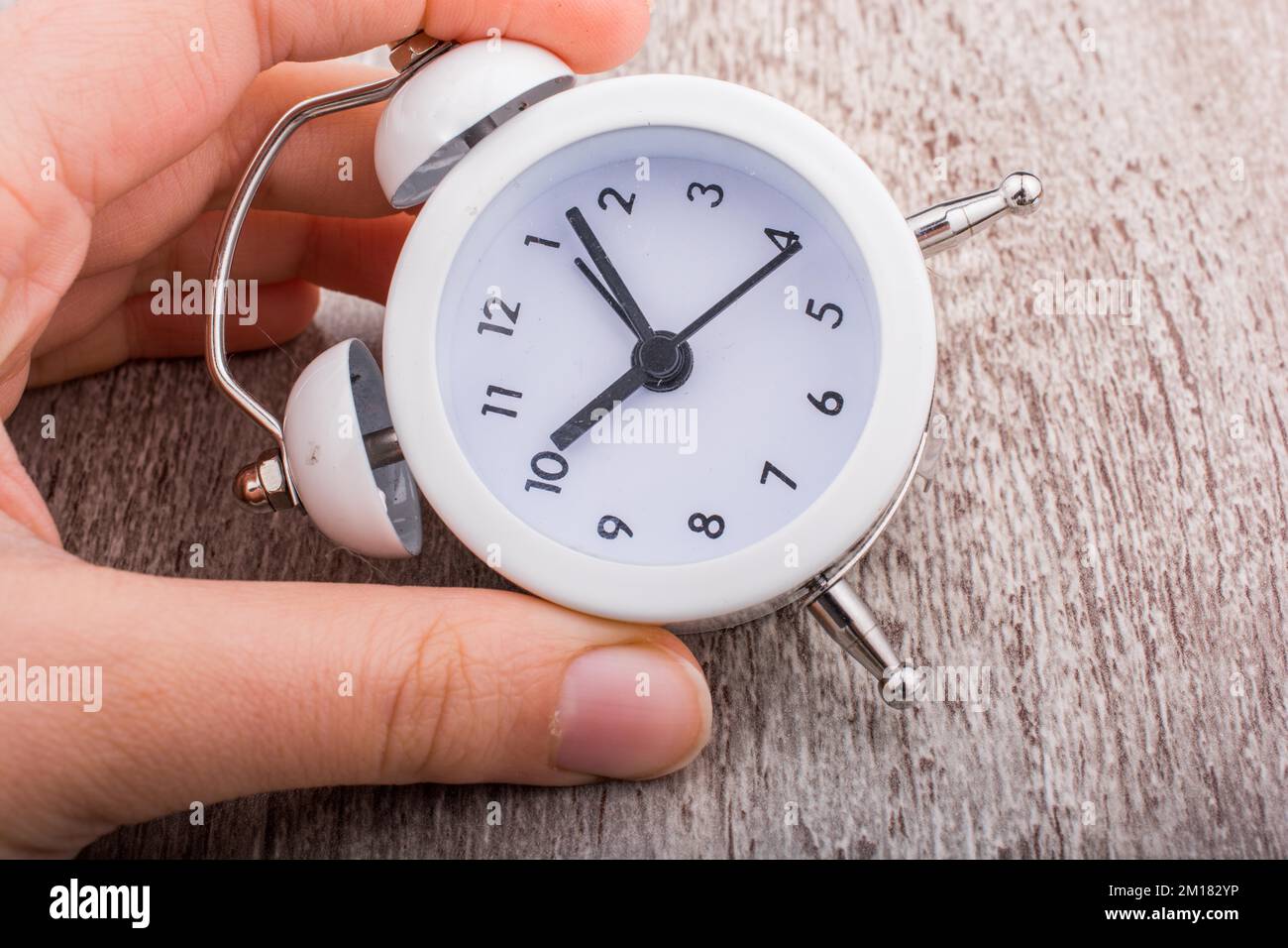 White color alarm clock on grey background Stock Photo - Alamy White color alarm clock on grey background Stock Photo - Alamy