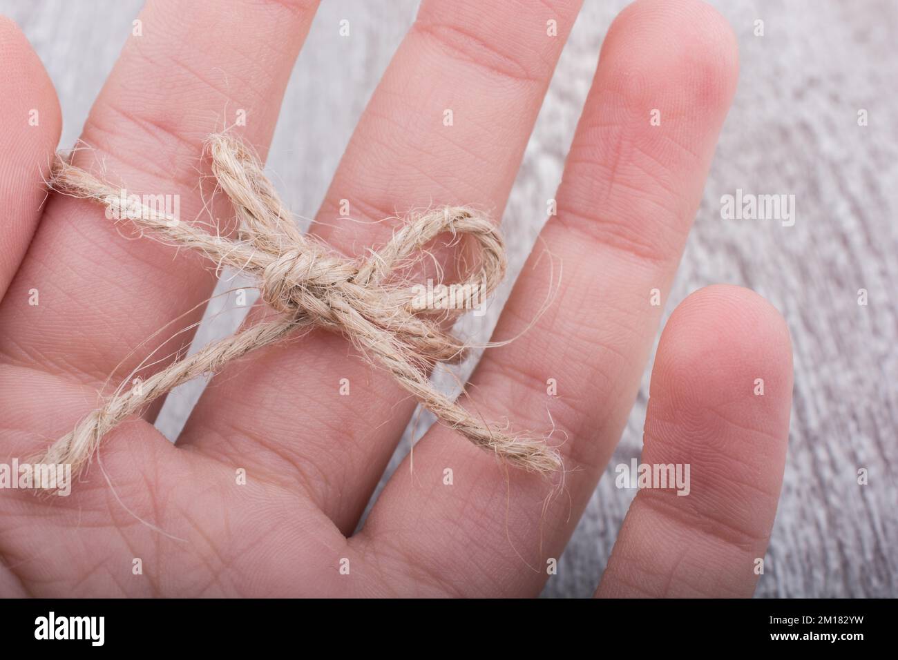 Hand in knot hi-res stock photography and images - Alamy