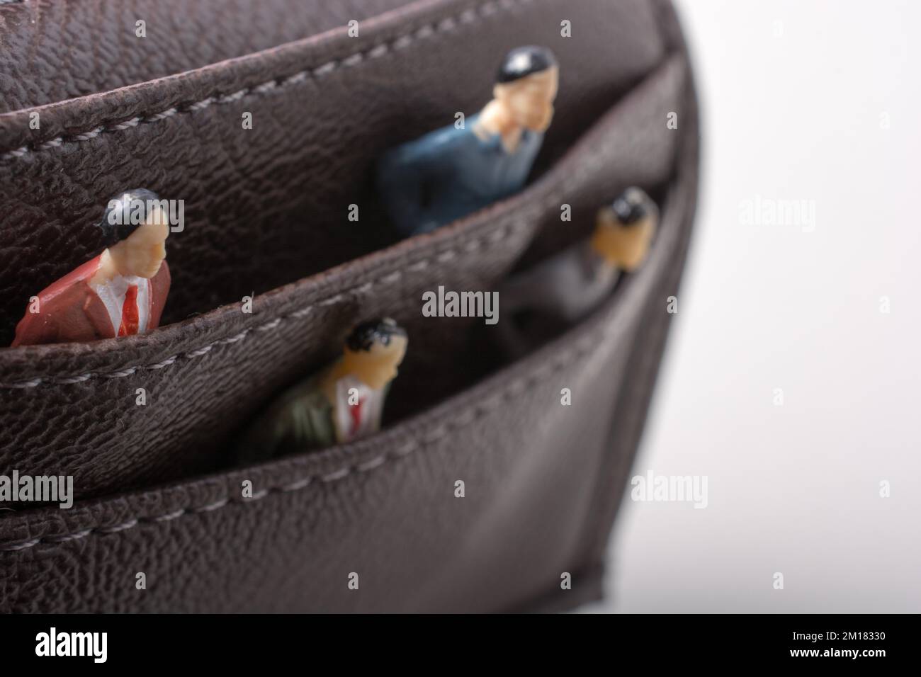 Tiny figurine of group of men miniature model in pockets Stock Photo ...
