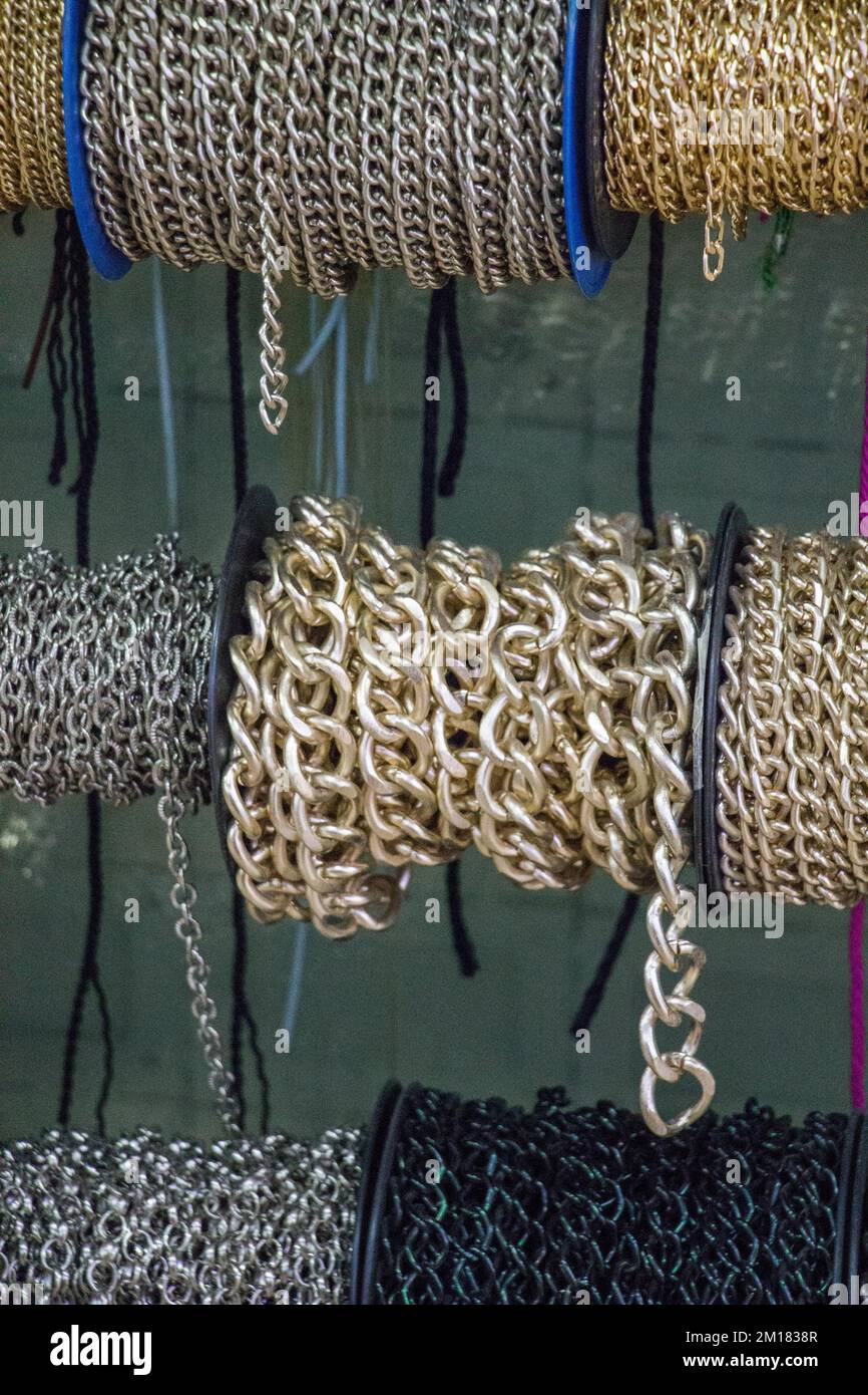 Rolls of decorative chains in view Stock Photo - Alamy