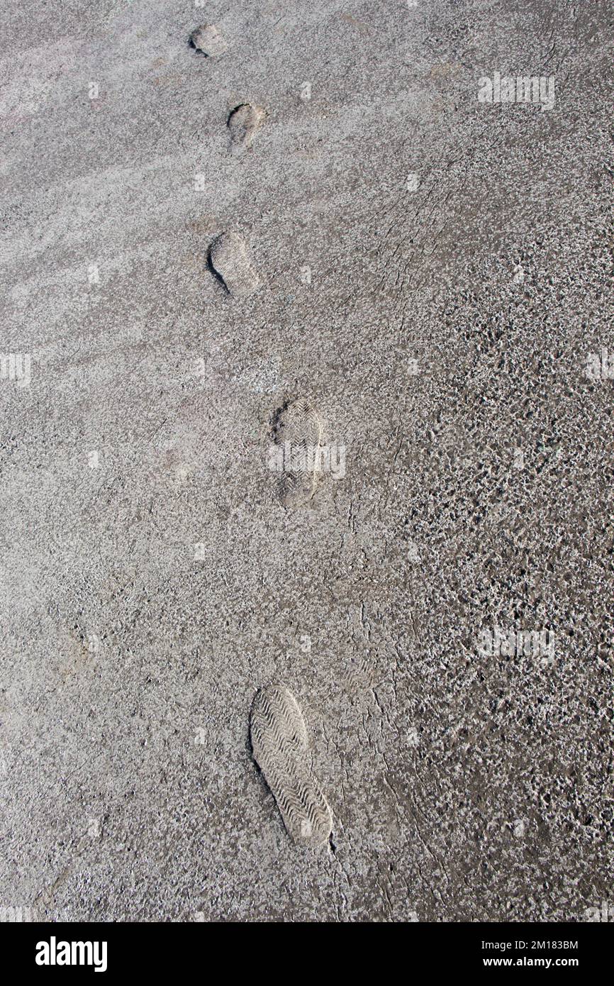 Footstep pattern seen on a concrete background Stock Photo - Alamy