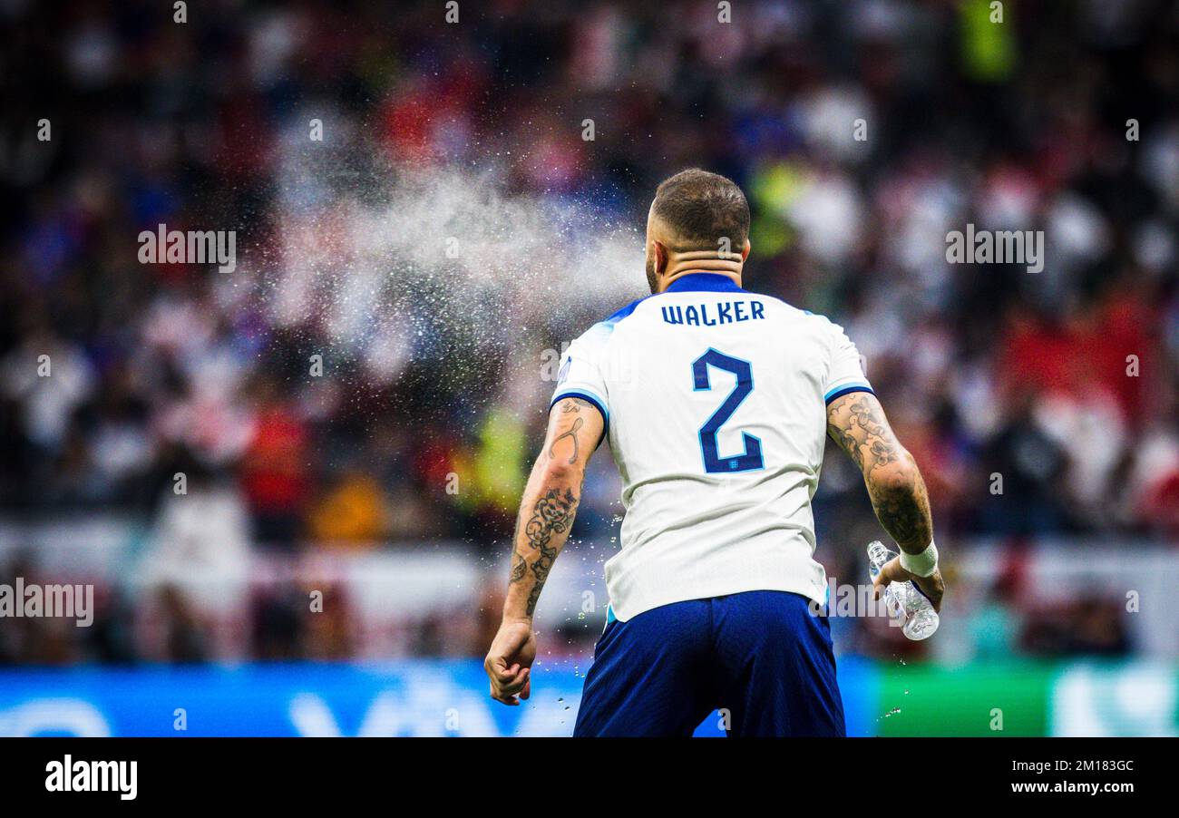 Doha, Qatar. 10th Dec, 2022. Kyle Walker (England) spits water England ...
