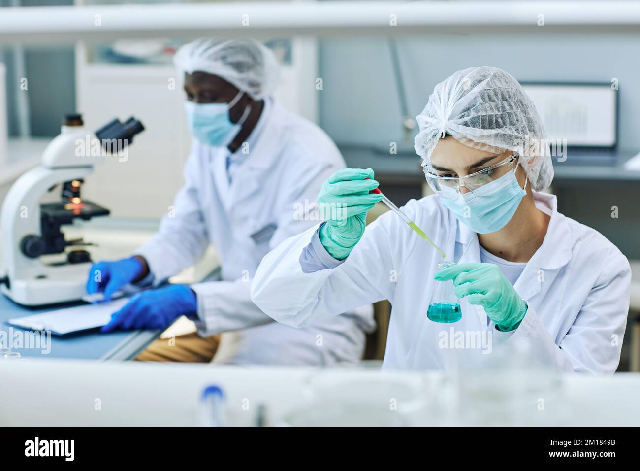 Woman experiment female research hi-res stock photography and images ...