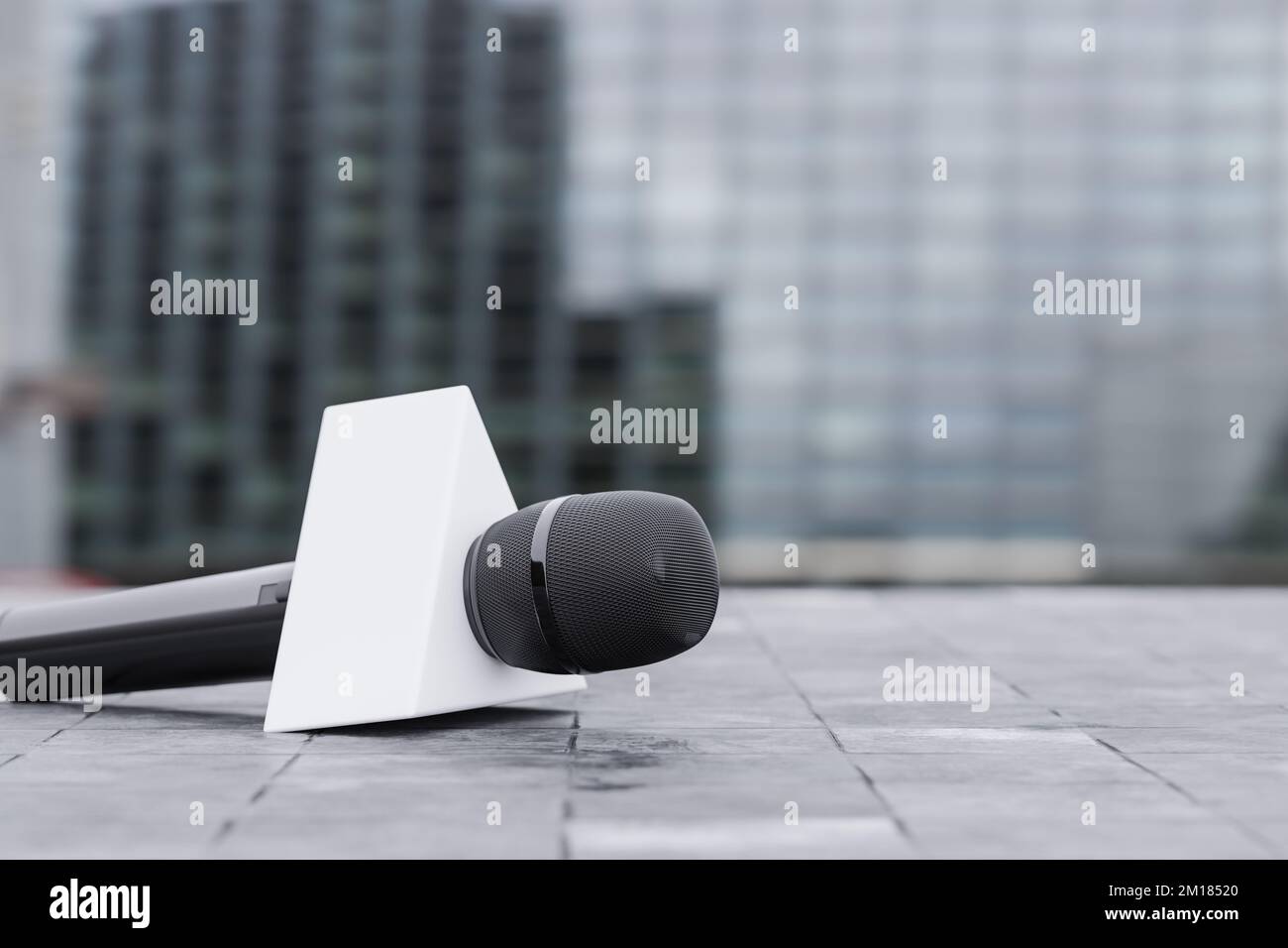 Mockup journalist microphone with blank white label. city news ...