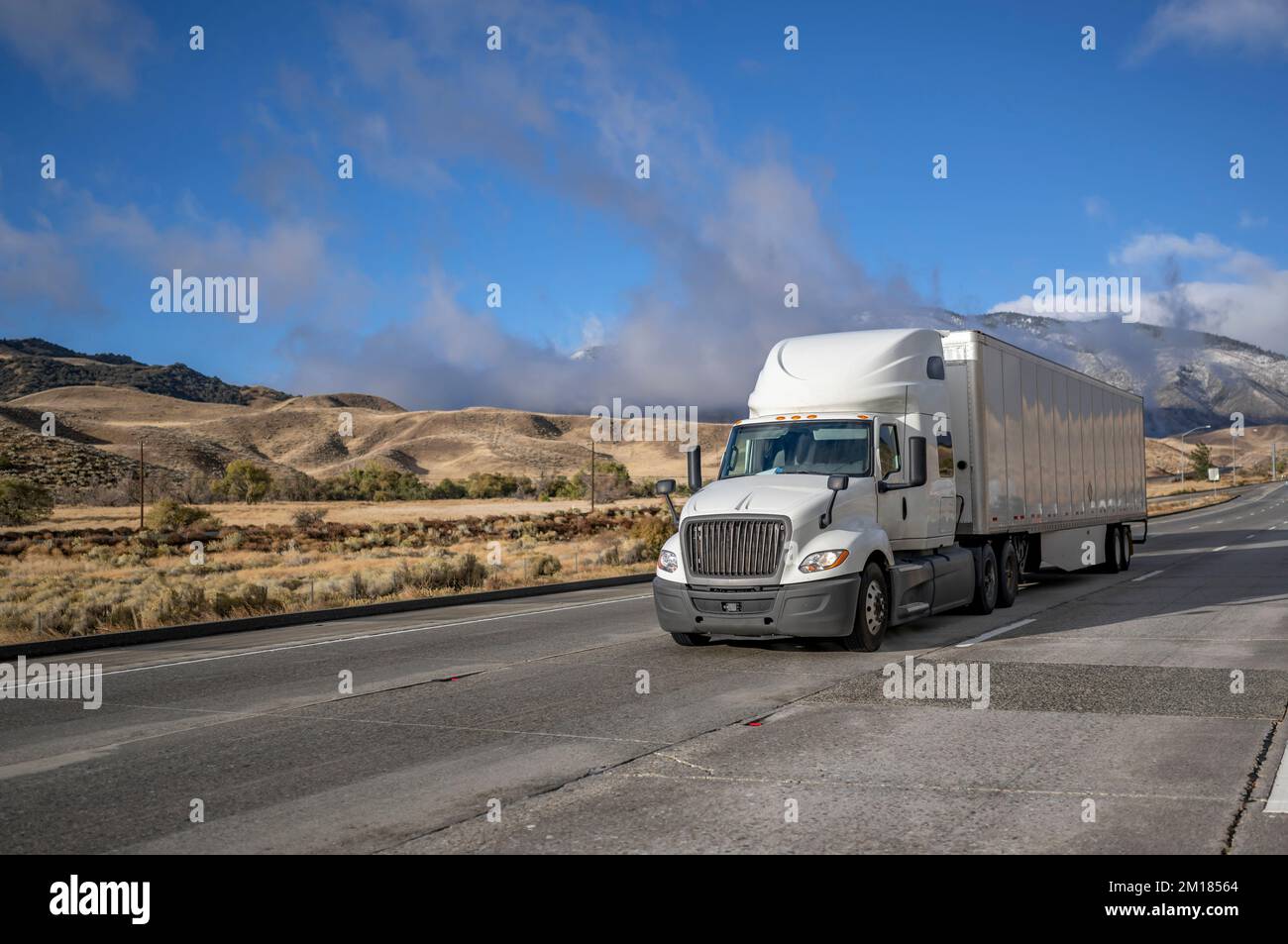 Industrial long hauler big rig white semi truck tractor with chrome ...