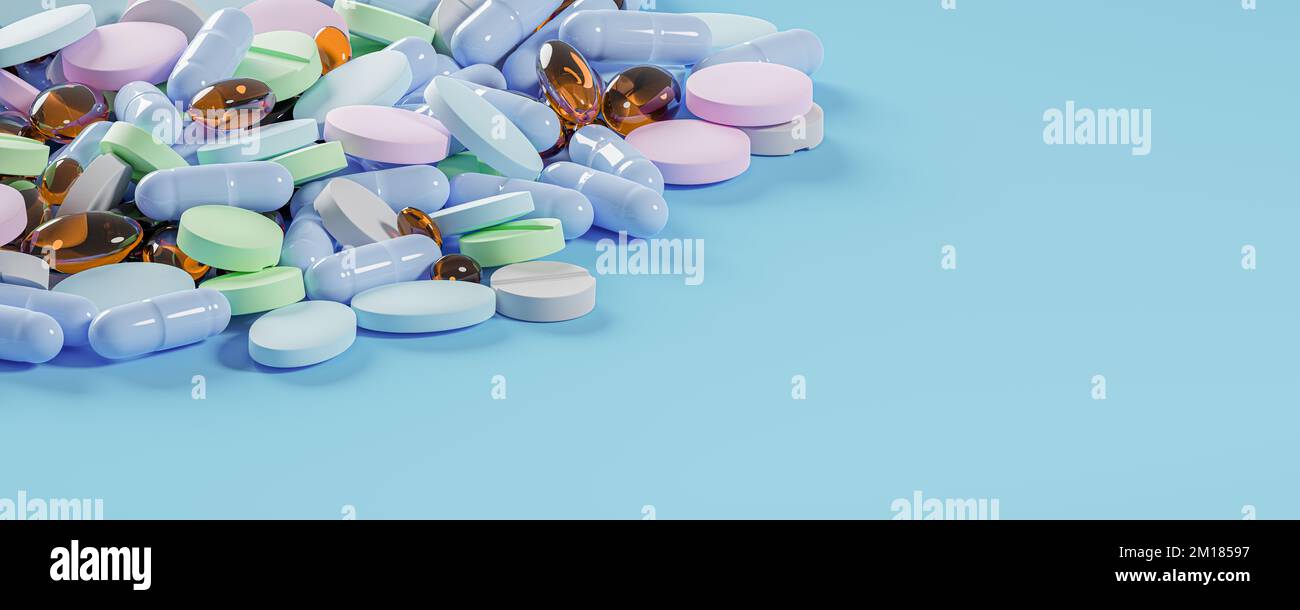 Different color pills on blue background. Drugs and medicines ...