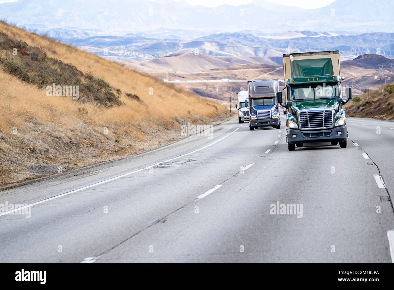 Convoy of a industrial grade commercial transportation of different big ...