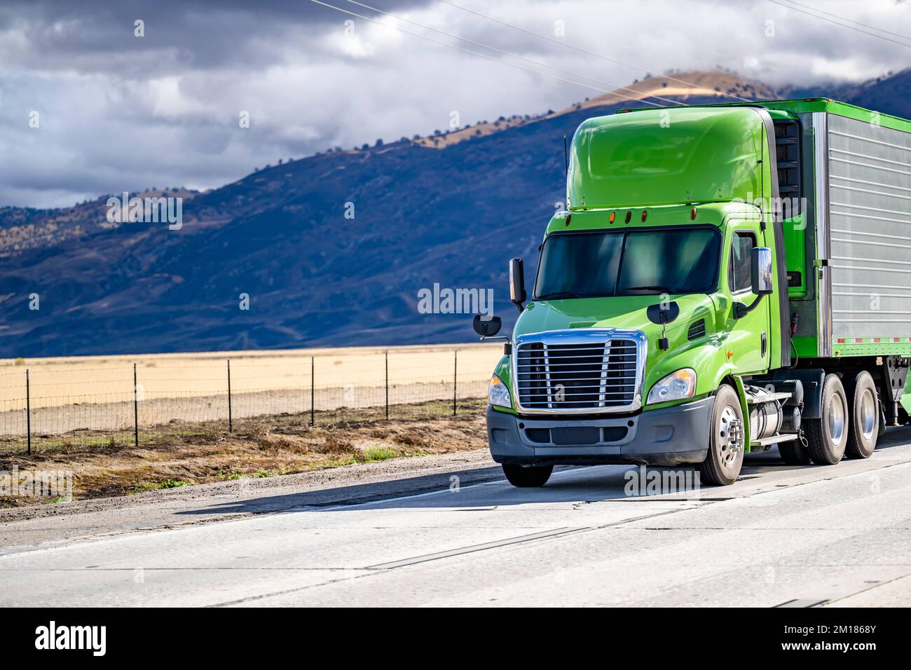Industrial day cab big rig green semi truck tractor with roof spoiler ...