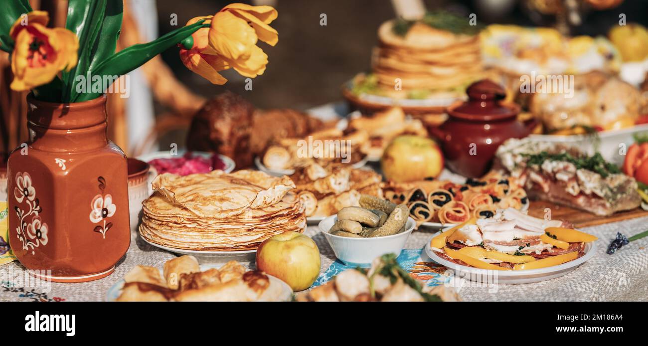 Dishes of the traditional Belarusian cuisine - pancakes, pancakes with ...