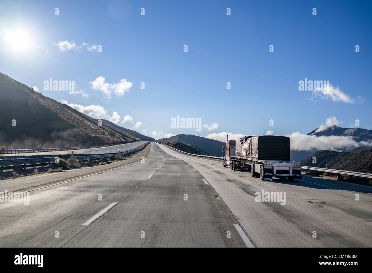 Industrial long hauler big rig red semi truck with chrome parts ...