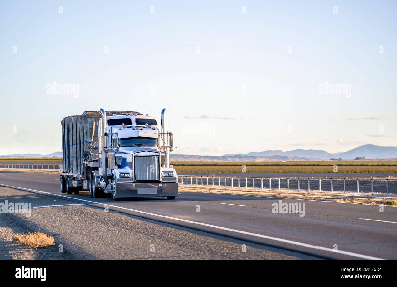 Long extended cab big rig white classic powerful stylish semi truck ...