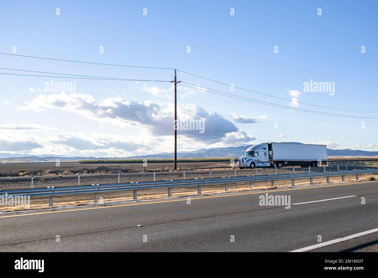Industrial grade big rig white semi truck tractor with high cab ...