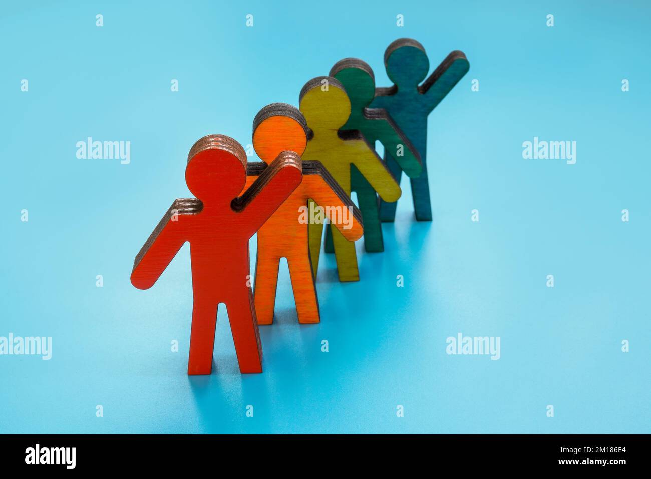 A line of colored figures. Primacy bias concept Stock Photo - Alamy
