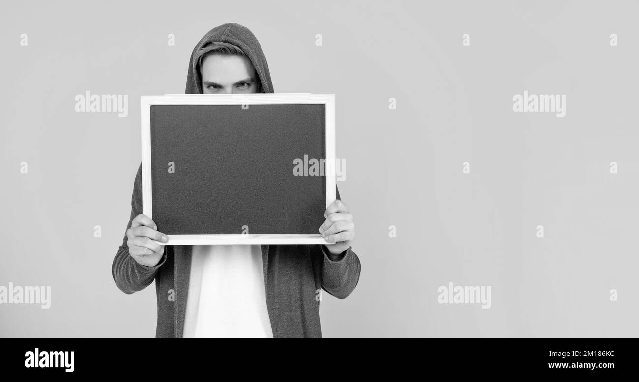 male behind chalkboard. place for useful information. advertisement ...