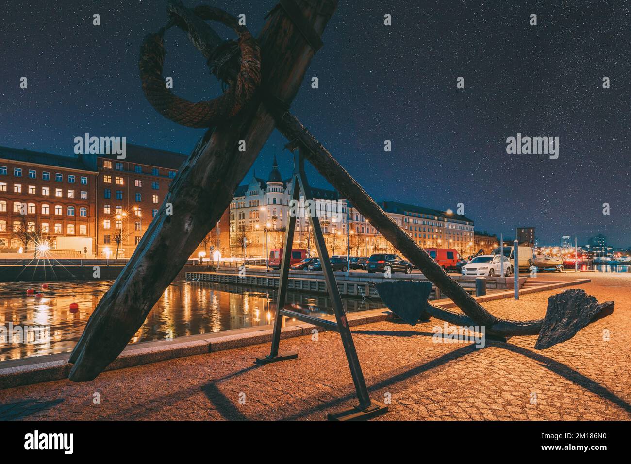 Helsinki, Finland. Old Anchor On Pier With View Of Pohjoisranta Street ...