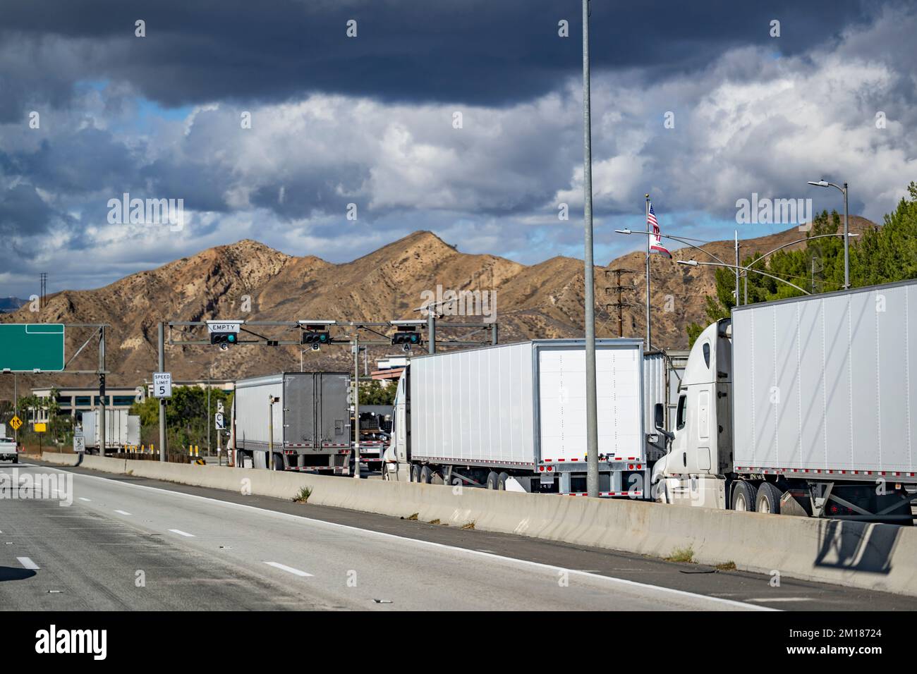 Convoy of industrial grade commercial transportation of different big ...