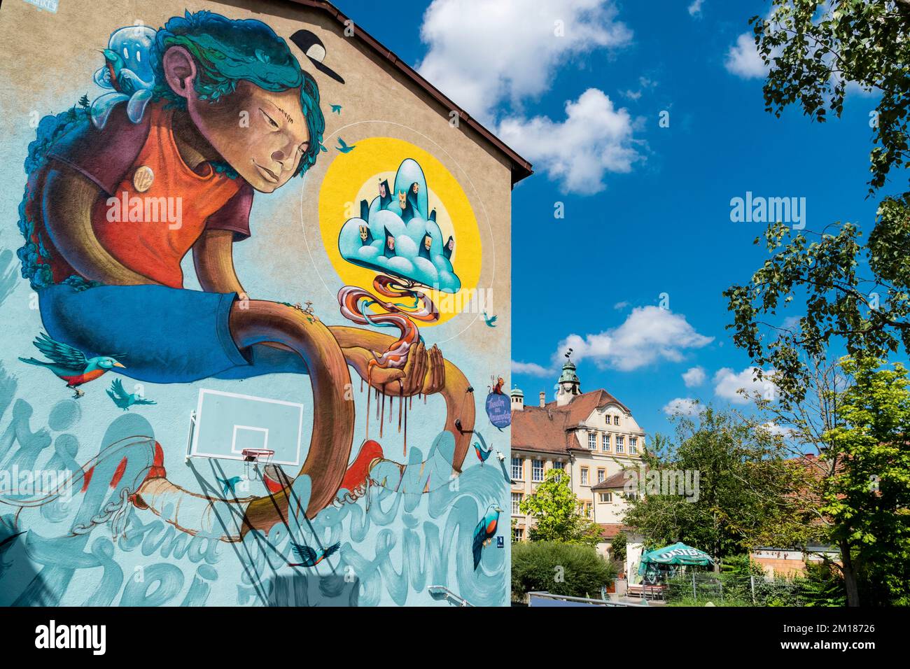 A colorful graffity with comic motive is painted at a house wall Stock ...