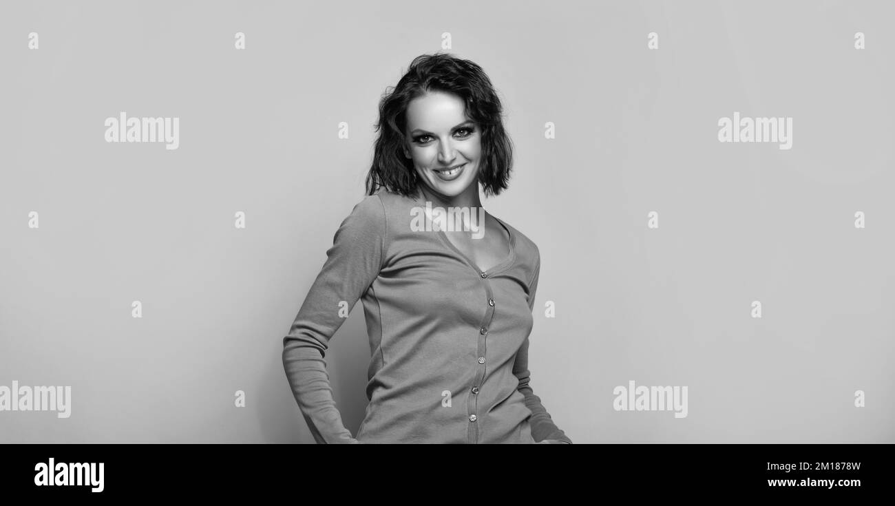 Happy girl in fashion pink sweater posing beige background, model Stock ...