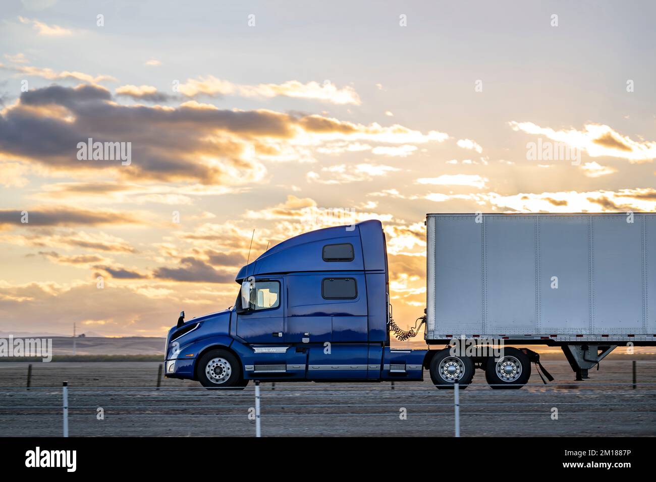 Industrial long hauler big rig blue semi truck tractor with chrome ...