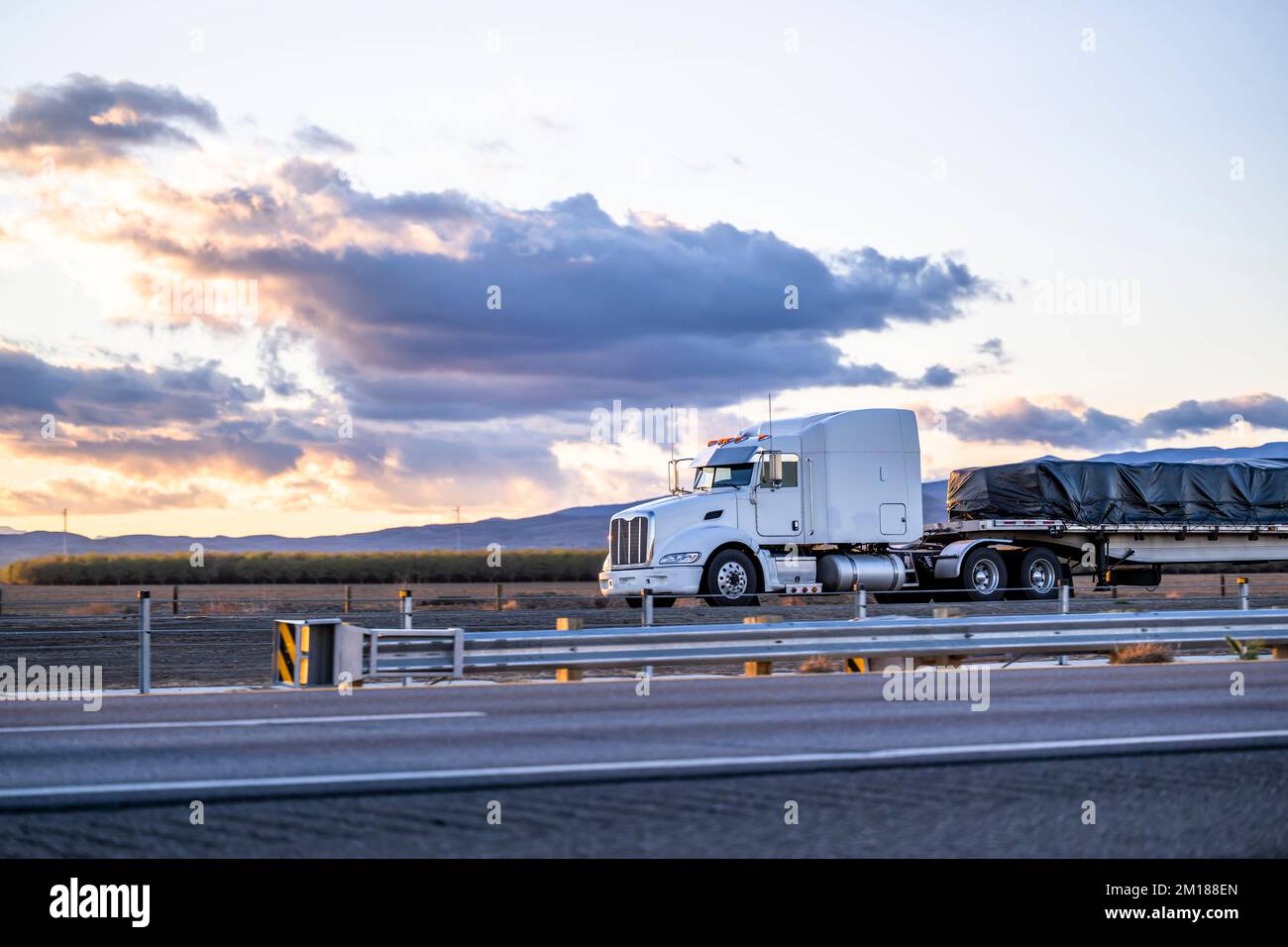 Industrial long hauler big rig white semi truck with chrome parts ...