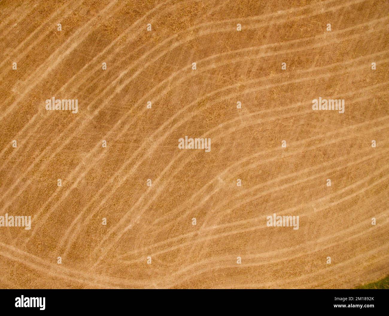An aerial view of a field with tire traces Stock Photo - Alamy