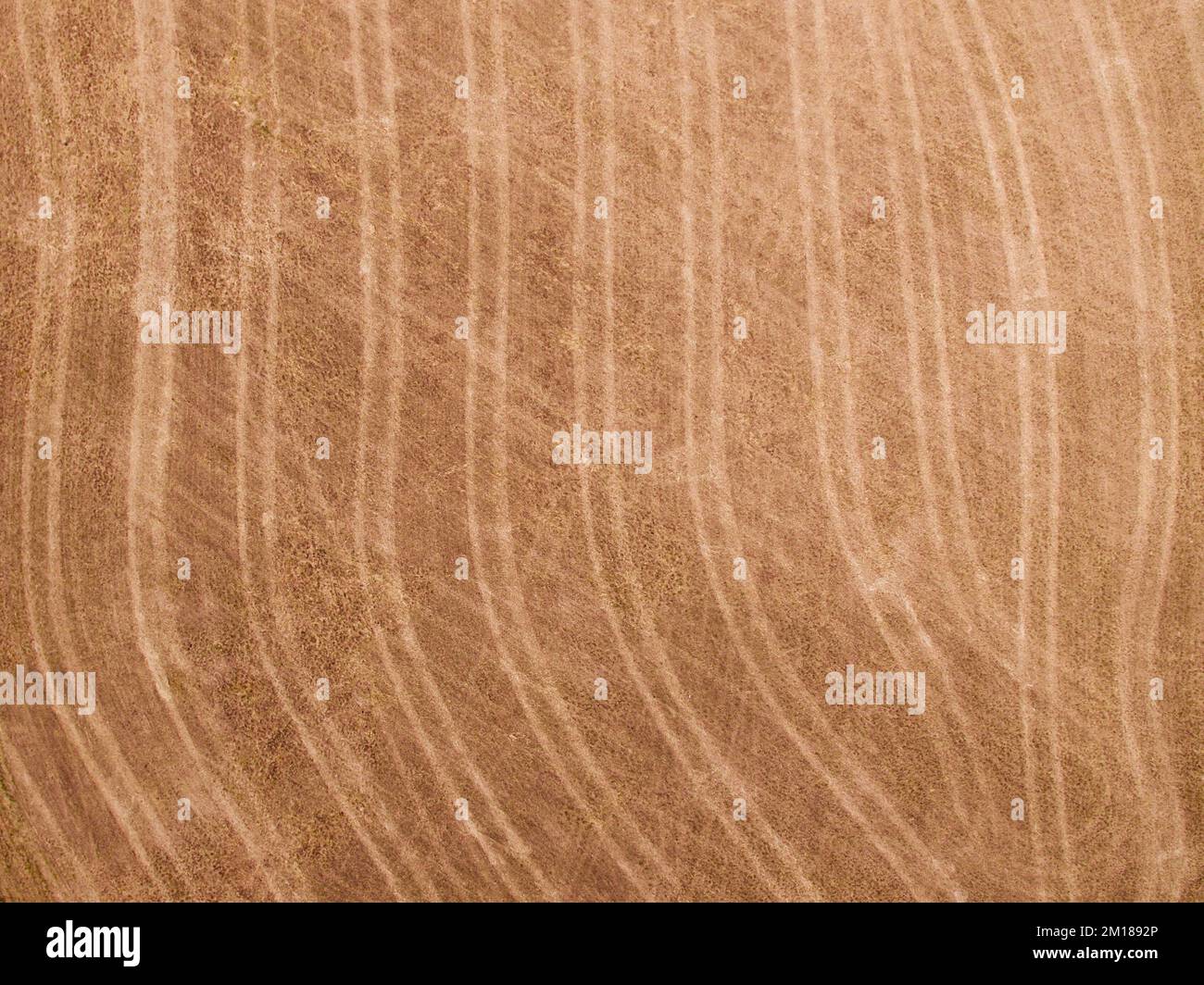 An aerial view of a field with tire traces Stock Photo - Alamy