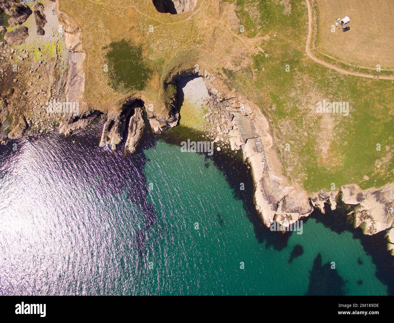 An aerial view of green cliffs facing the sea in the morning Stock ...