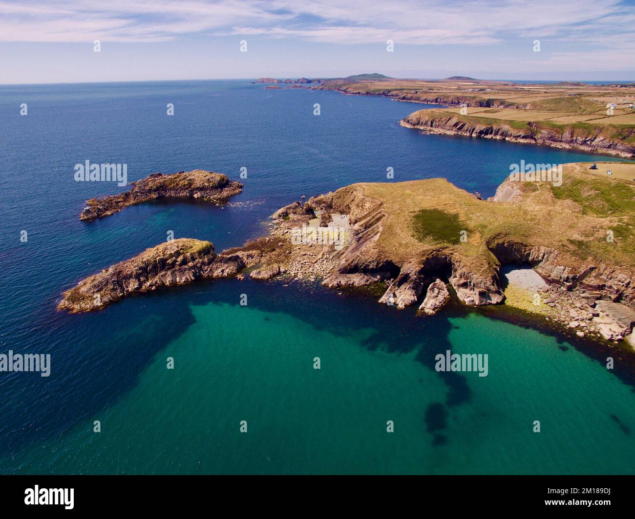 An aerial view of green cliffs facing the sea in the morning Stock ...