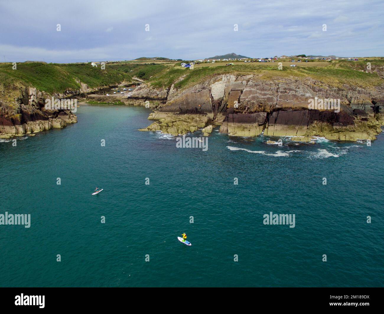 An aerial view of green cliffs facing the sea in the morning Stock ...