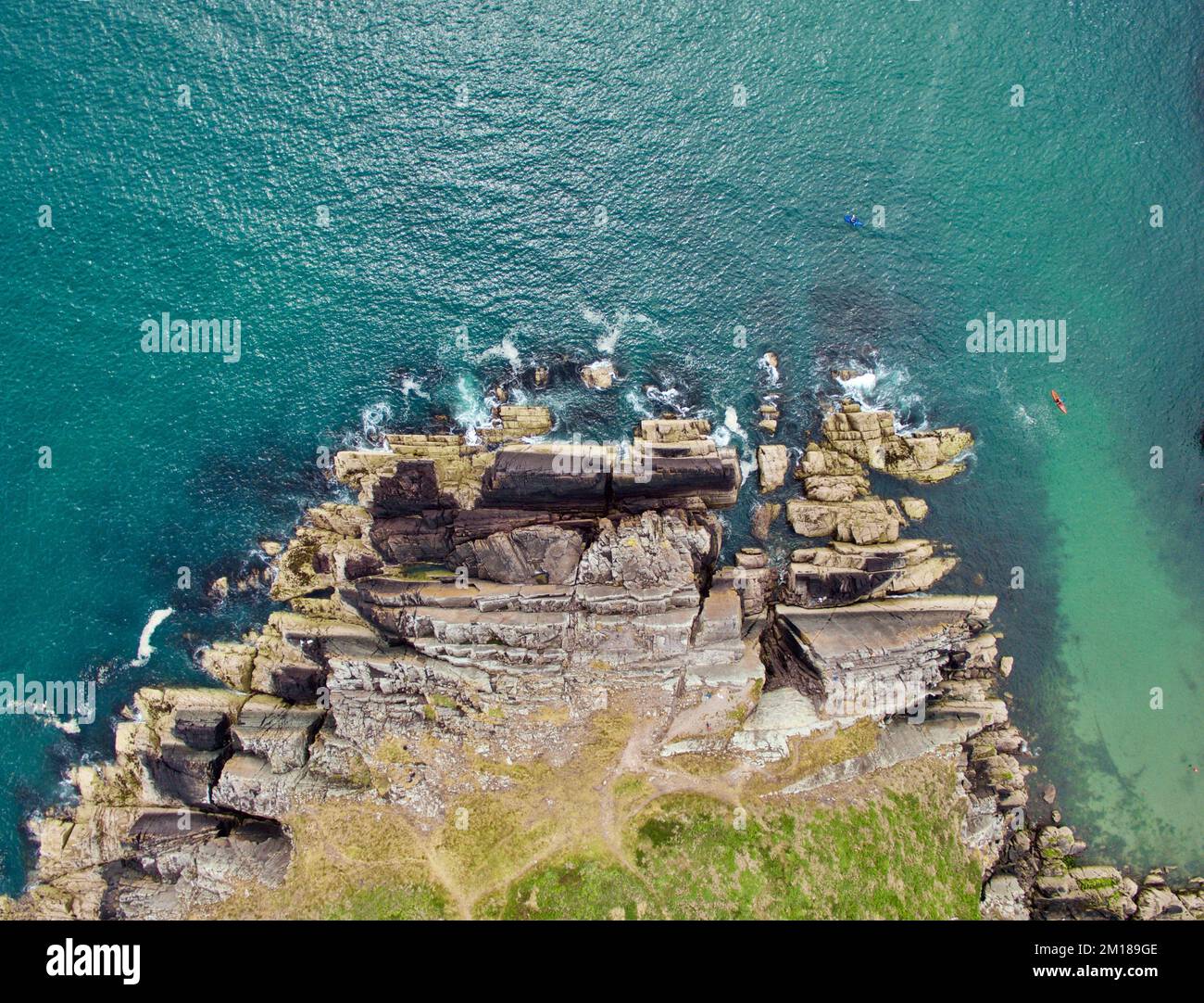 An aerial view of green cliffs facing the sea in the morning Stock ...