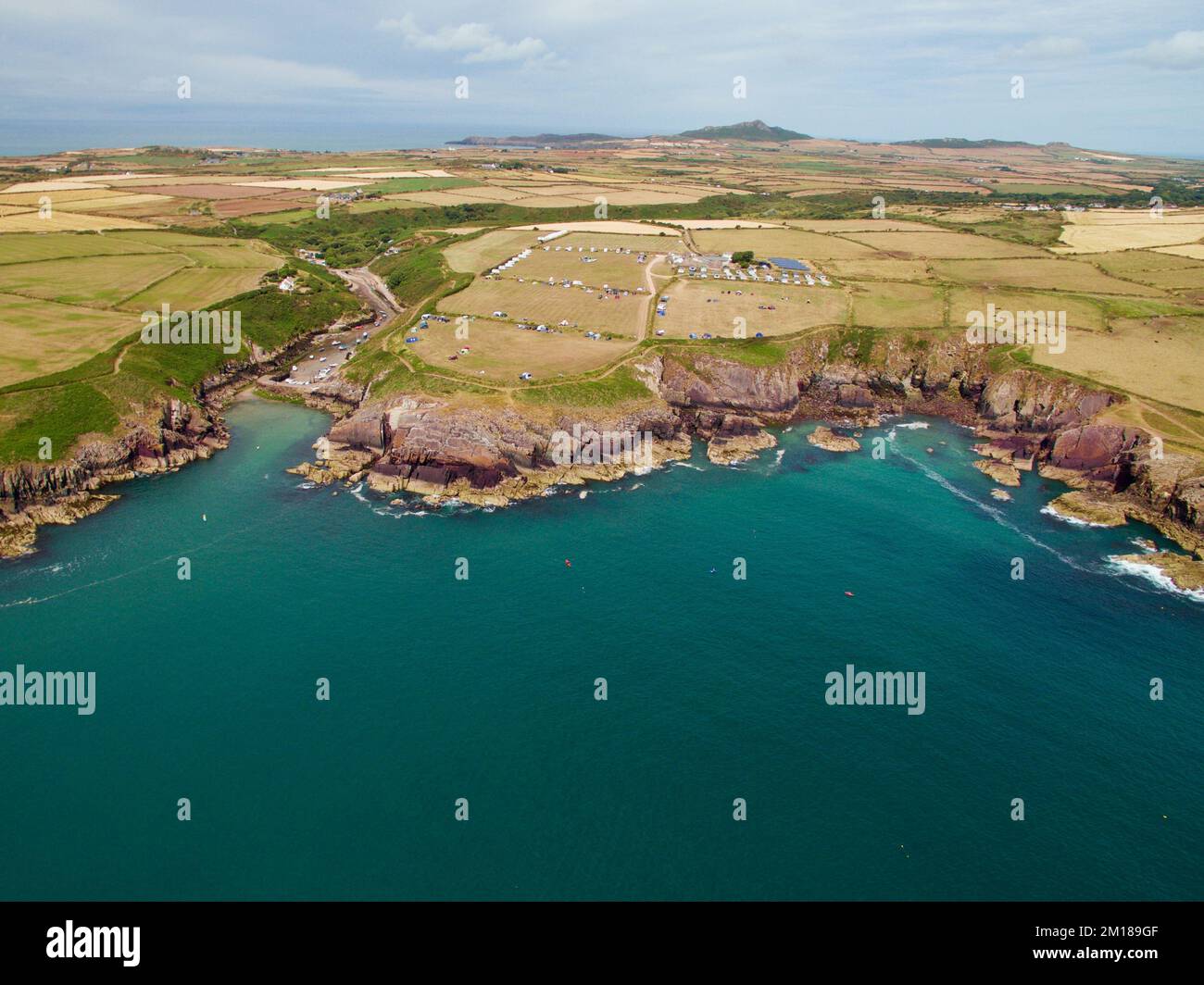 An aerial view of green cliffs facing the sea in the morning Stock ...