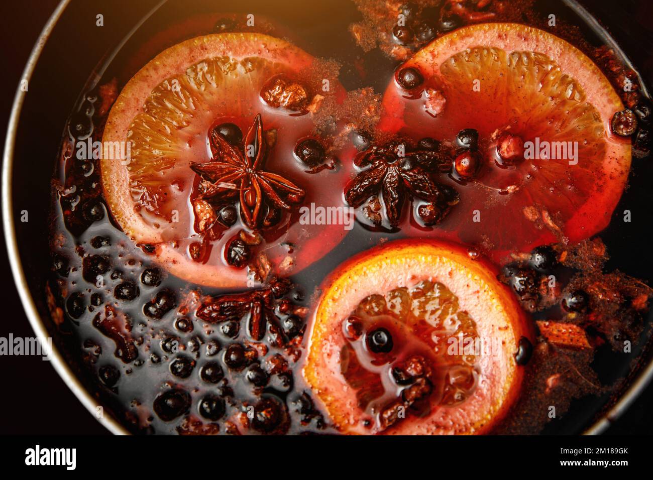 Hot mulled wine boiled in a pot Stock Photo - Alamy